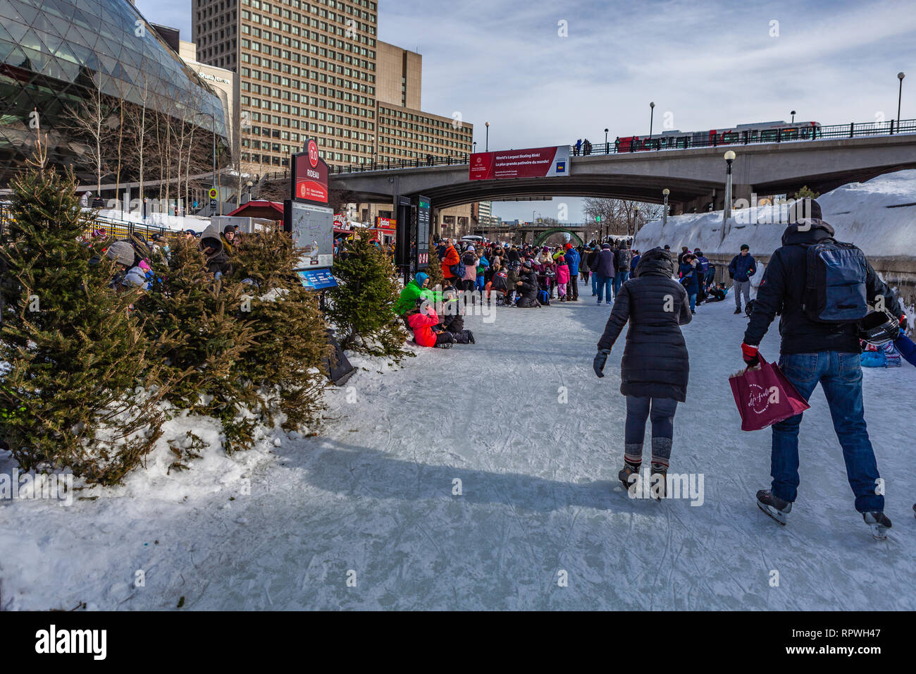 People celebrate the Winterlude festival on the frozen Rideau Canal ...