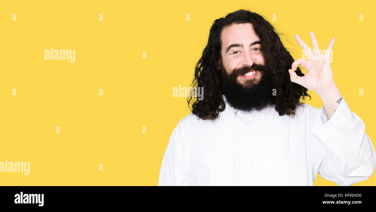 Man wearing Jesus Christ costume smiling positive doing ok sign with ...