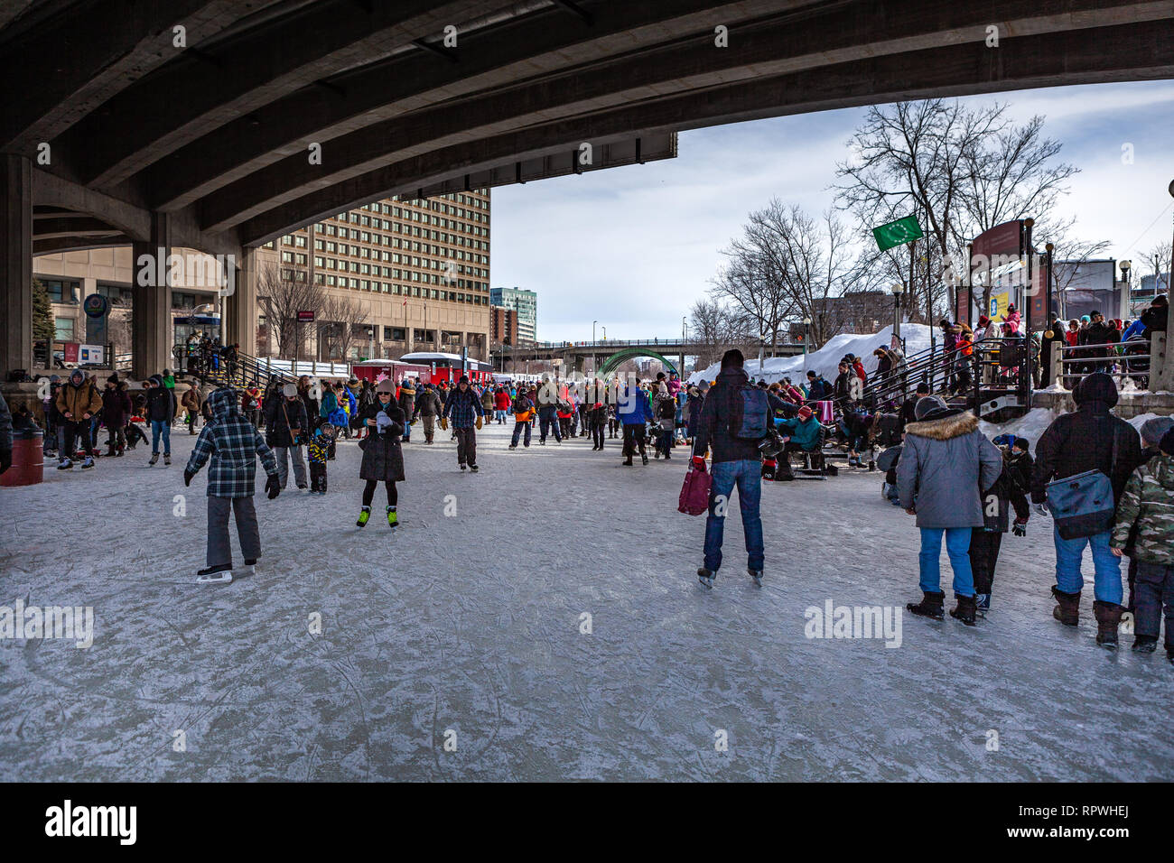 People celebrate the Winterlude festival on the frozen Rideau Canal ...