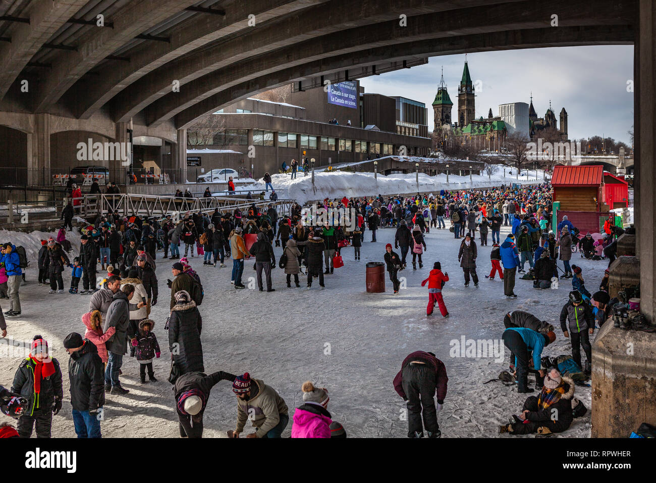 People celebrate the Winterlude festival on the frozen Rideau Canal ...