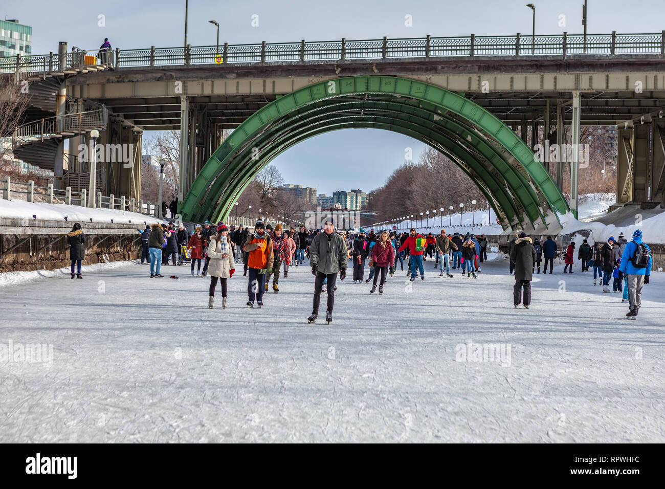 People celebrate the Winterlude festival on the frozen Rideau Canal ...