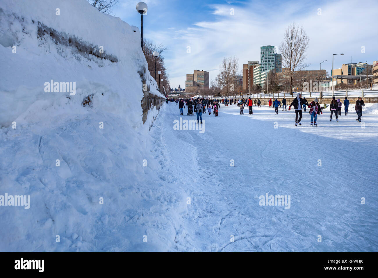 People celebrate the Winterlude festival on the frozen Rideau Canal ...