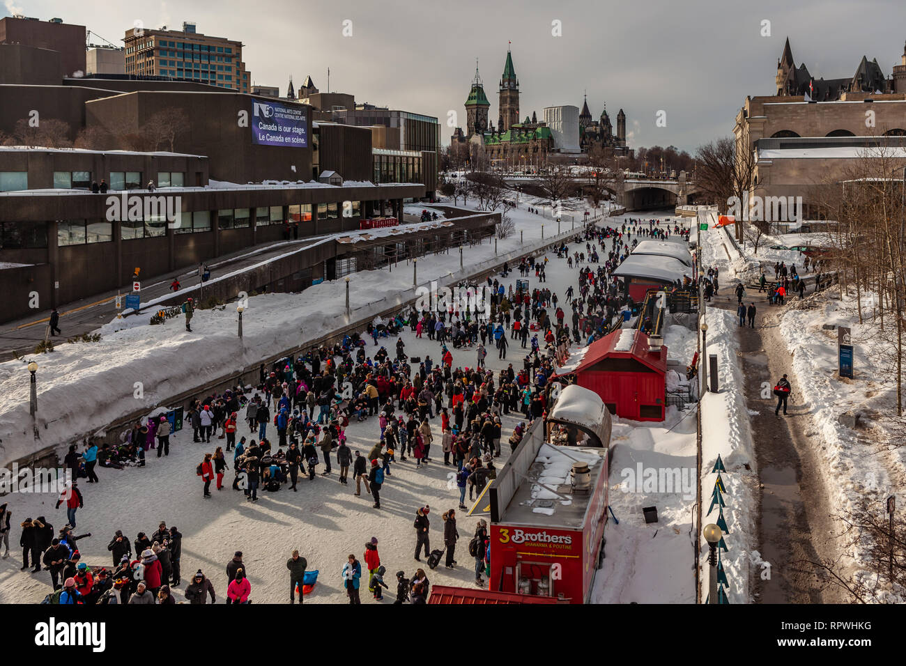 People celebrate the Winterlude festival on the frozen Rideau Canal ...