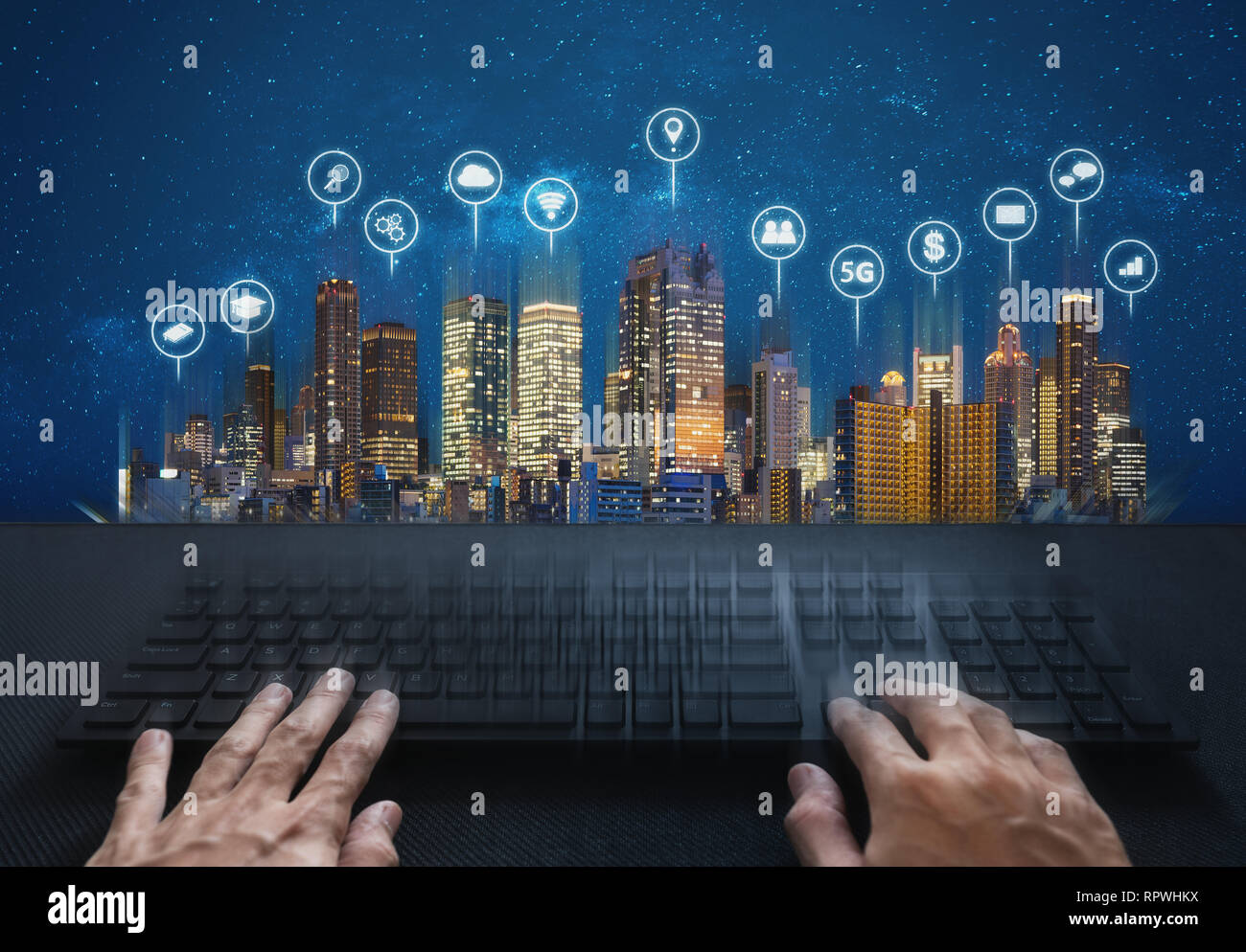 Computer networking and internet connection. Hand typing computer keyboard and buildings with ...