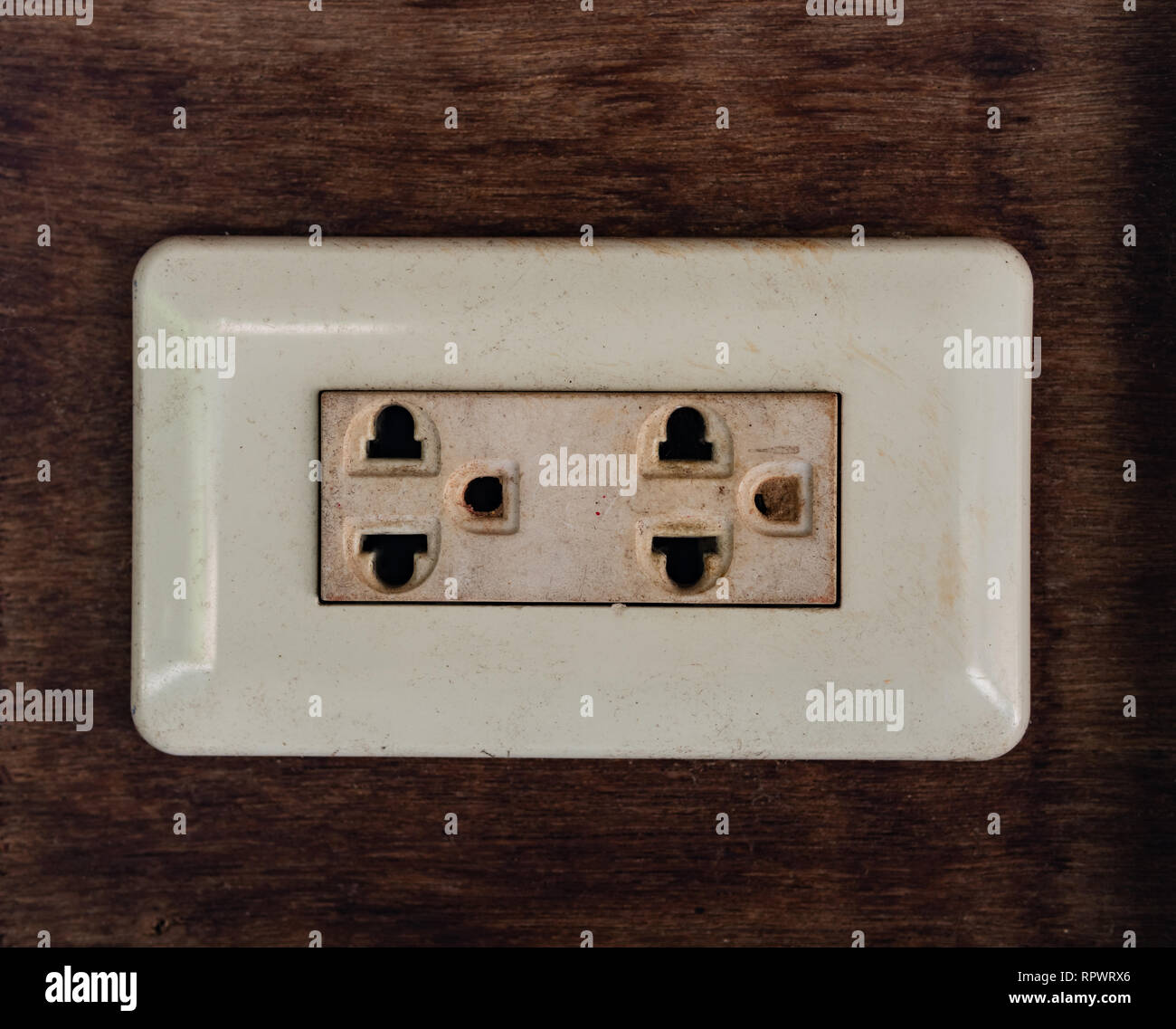 Old power plug on old wood background Stock Photo - Alamy