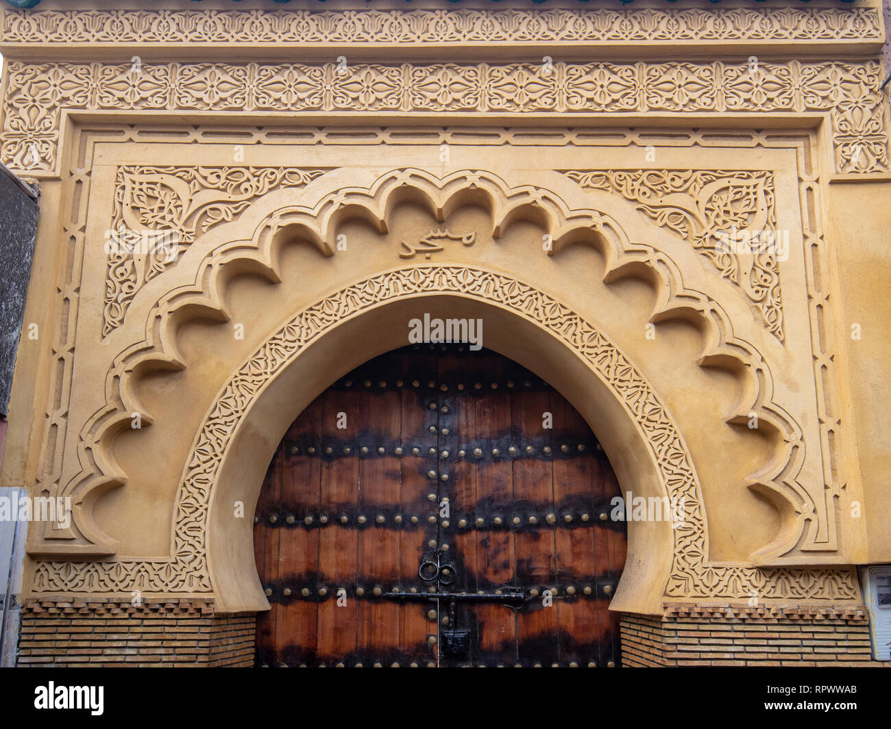 Traditional Moroccan style design of an ancient wooden entry riad door ...