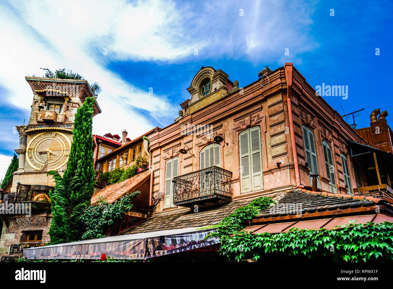 View on Traditional carved balconies and colorful wooden hous in the ...