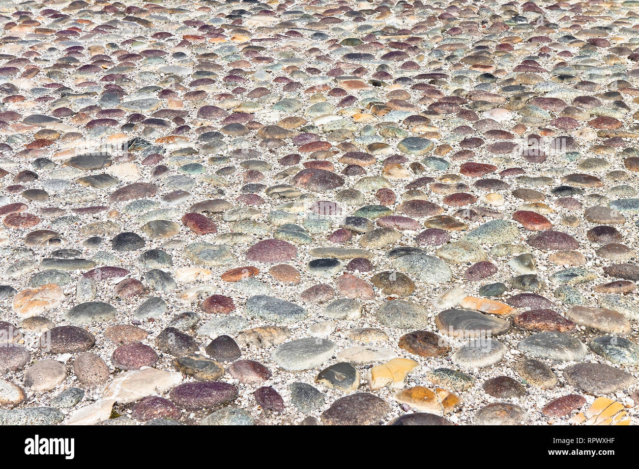Detail of a pebble floor with dark polished stone Stock Photo - Alamy
