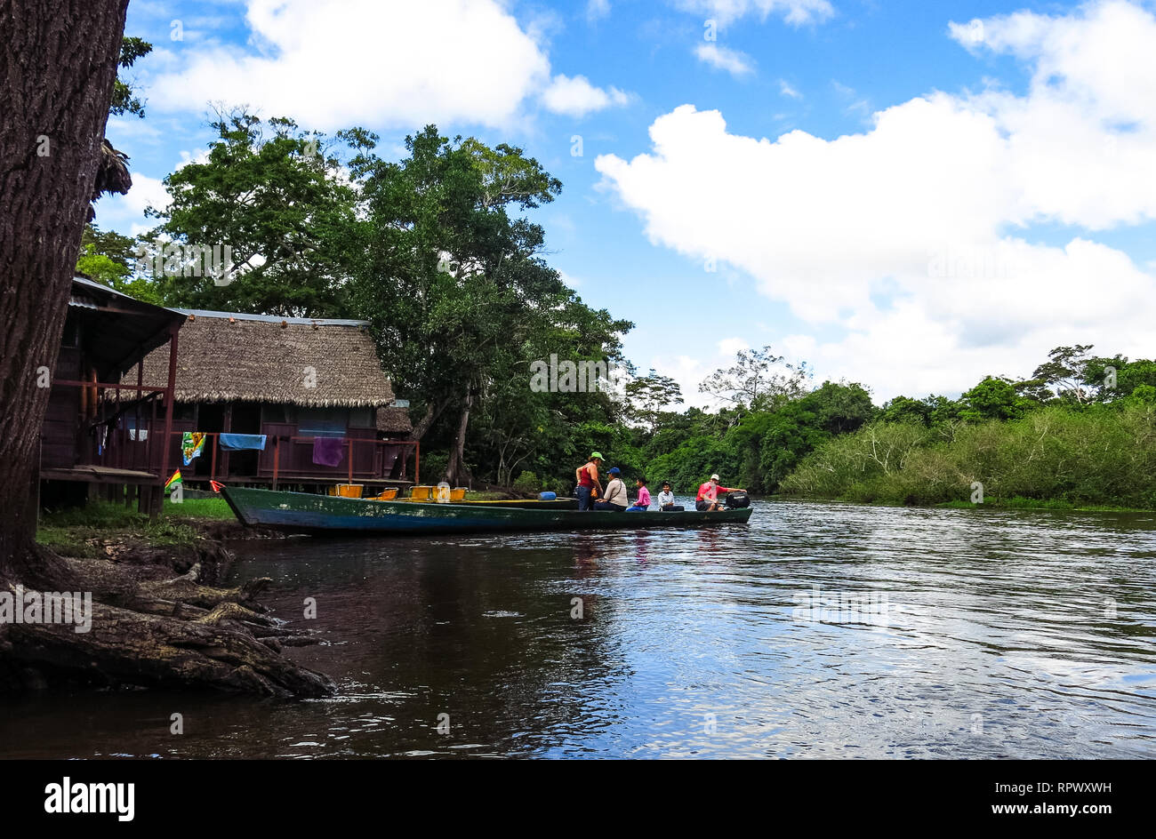 Madidi river, Bolivia - MAY 5: Instant of a boat with people sailing in ...