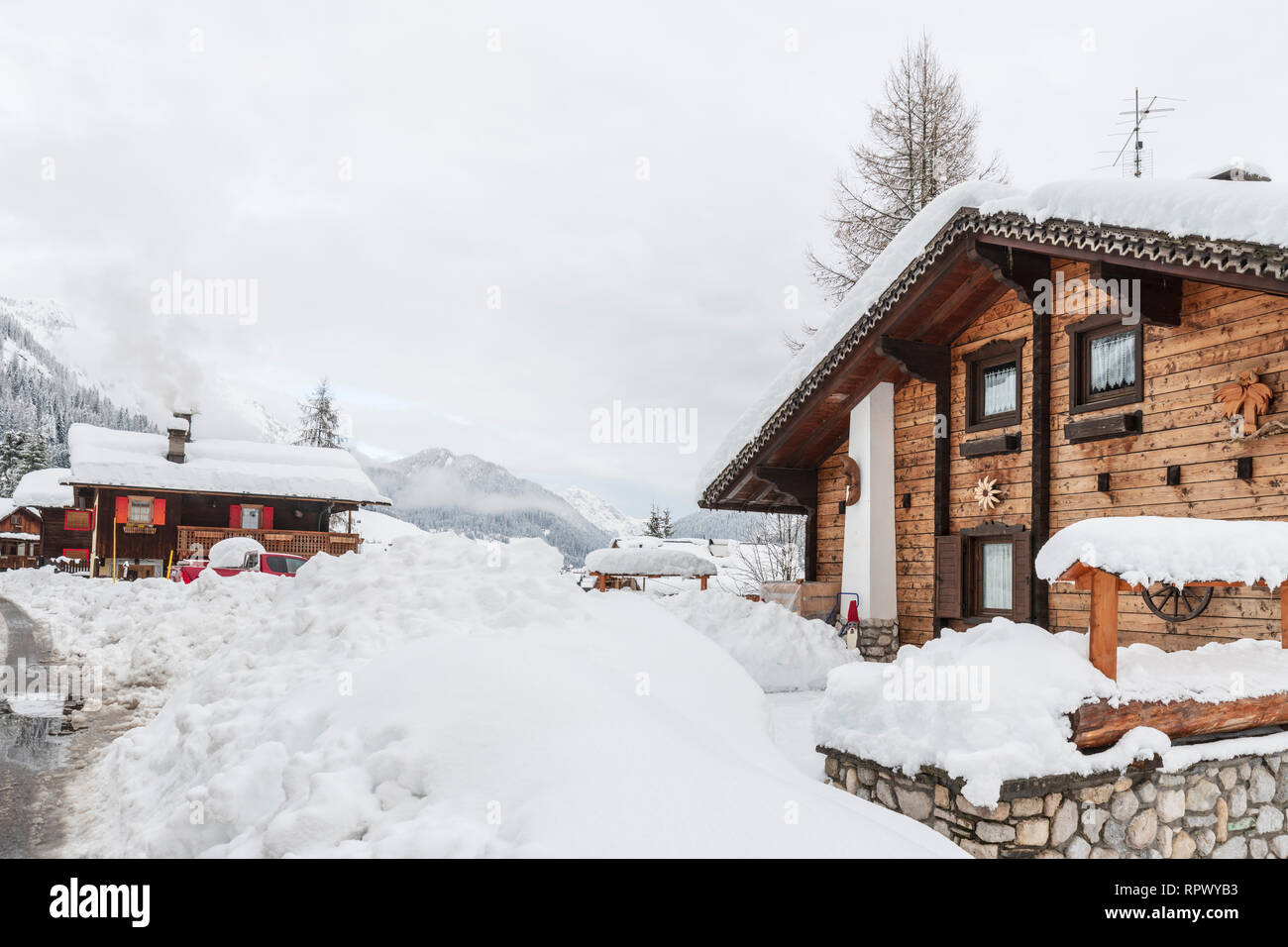 While it snows. Along the streets of the ancient village of Sappada ...