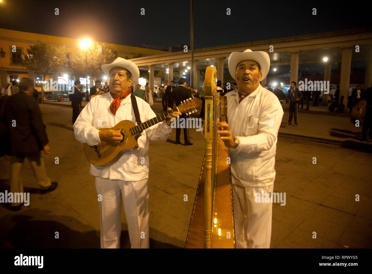 Mariachi musicians play mexican music at Garibaldi Square in Mexico ...