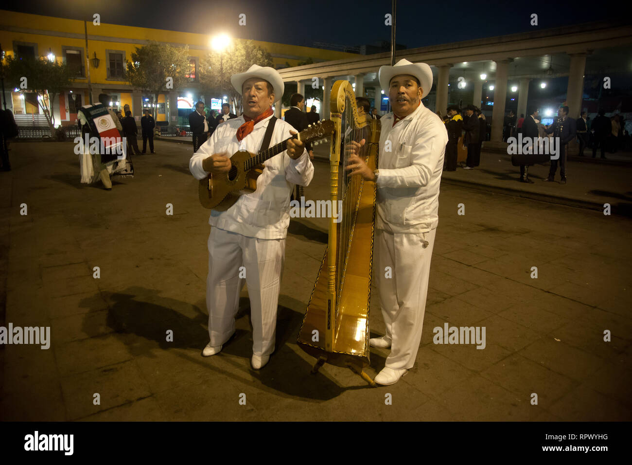 Mariachi musicians play mexican music at Garibaldi Square in Mexico ...