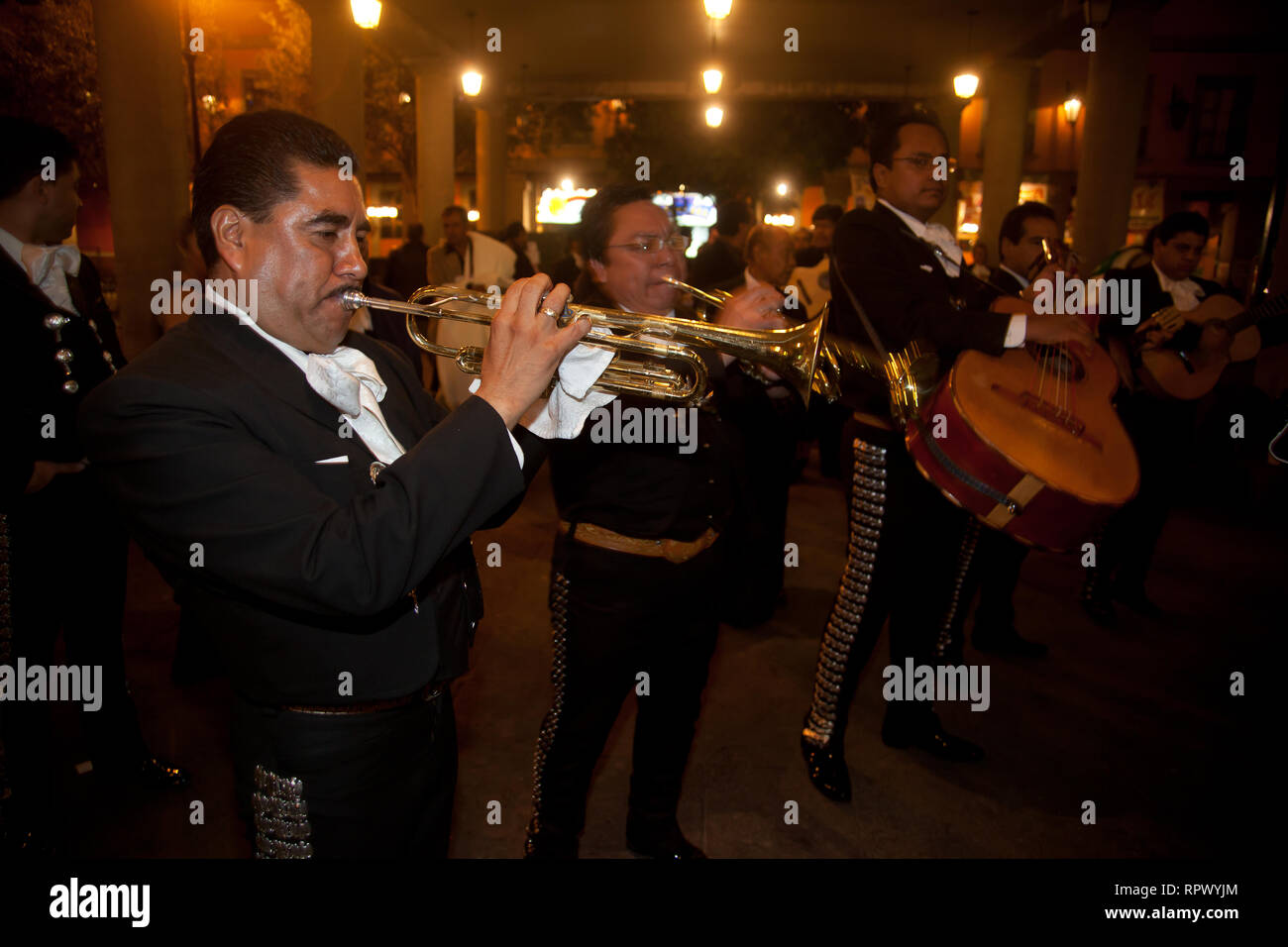 Mariachi musicians play mexican music at Garibaldi Square in Mexico ...