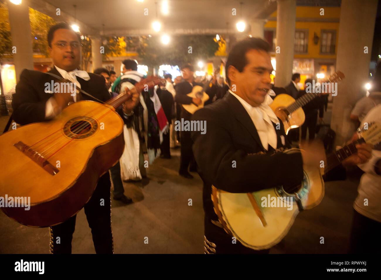 Mariachi musicians play mexican music at Garibaldi Square in Mexico ...