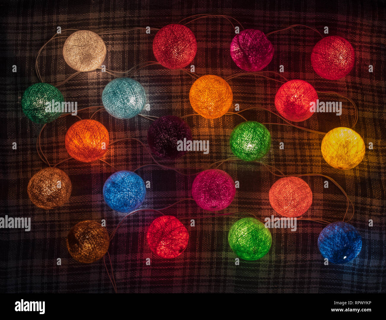 Colorful garland on the caged background Stock Photo - Alamy