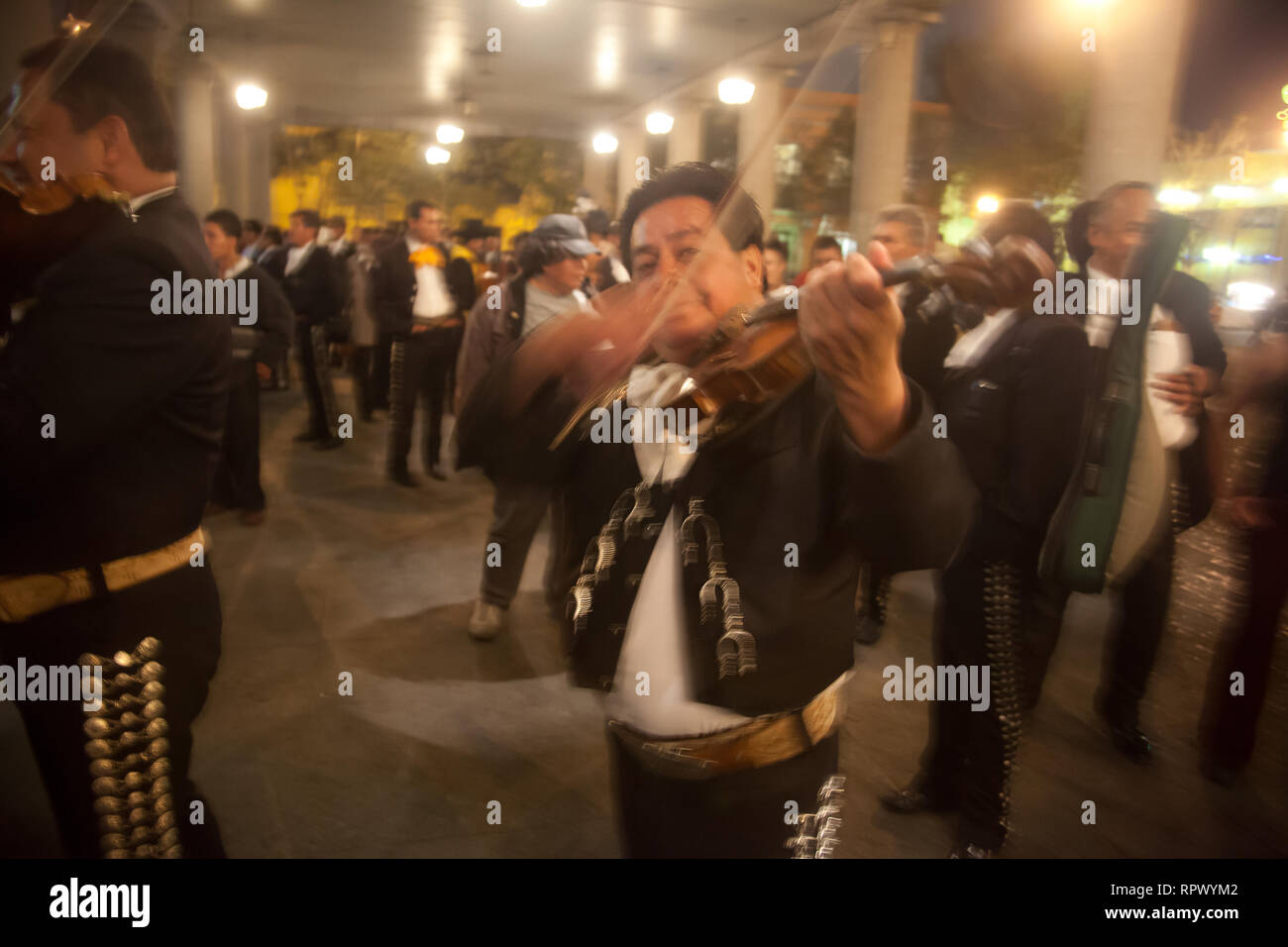 Mariachi musicians play mexican music at Garibaldi Square in Mexico ...