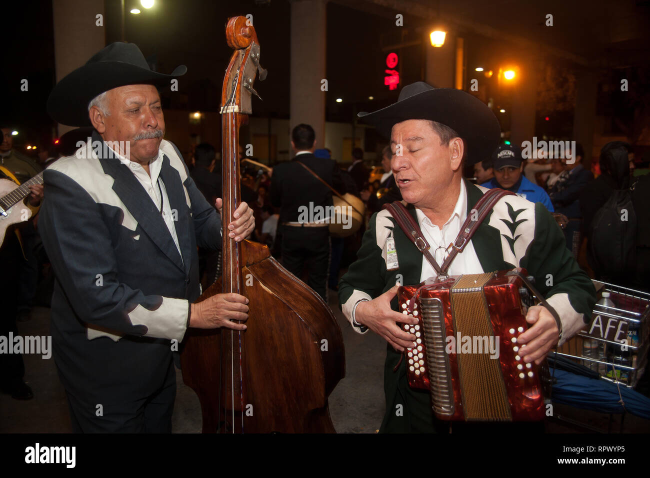 Mariachi musicians play mexican music at Garibaldi Square in Mexico ...