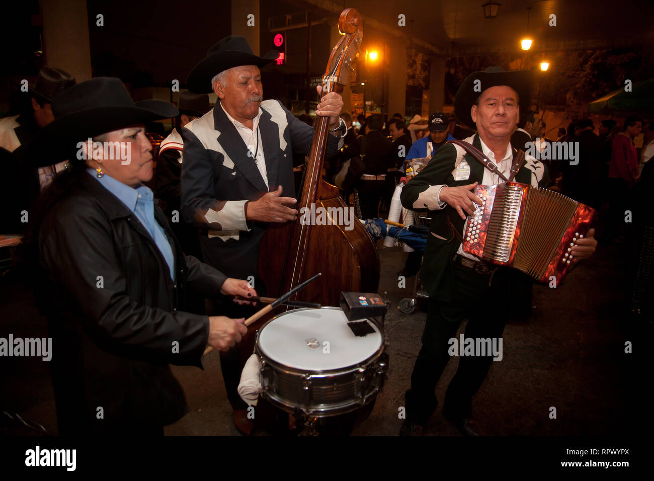 Mariachi musicians play mexican music at Garibaldi Square in Mexico ...