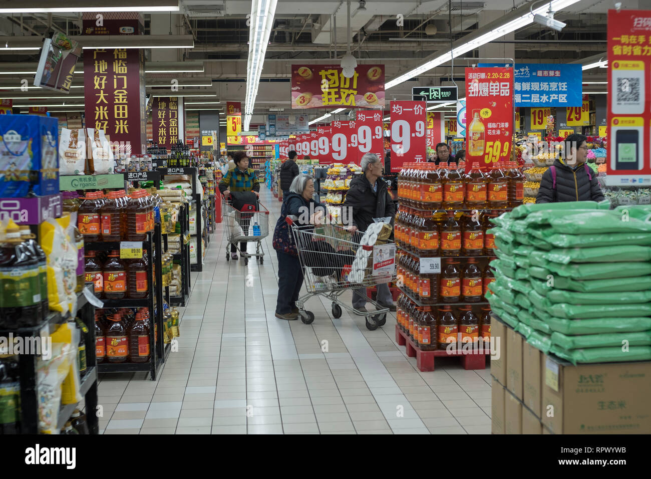 Consumers shopping at a Carrefour supermarket in Beijing, China. 23-Feb ...