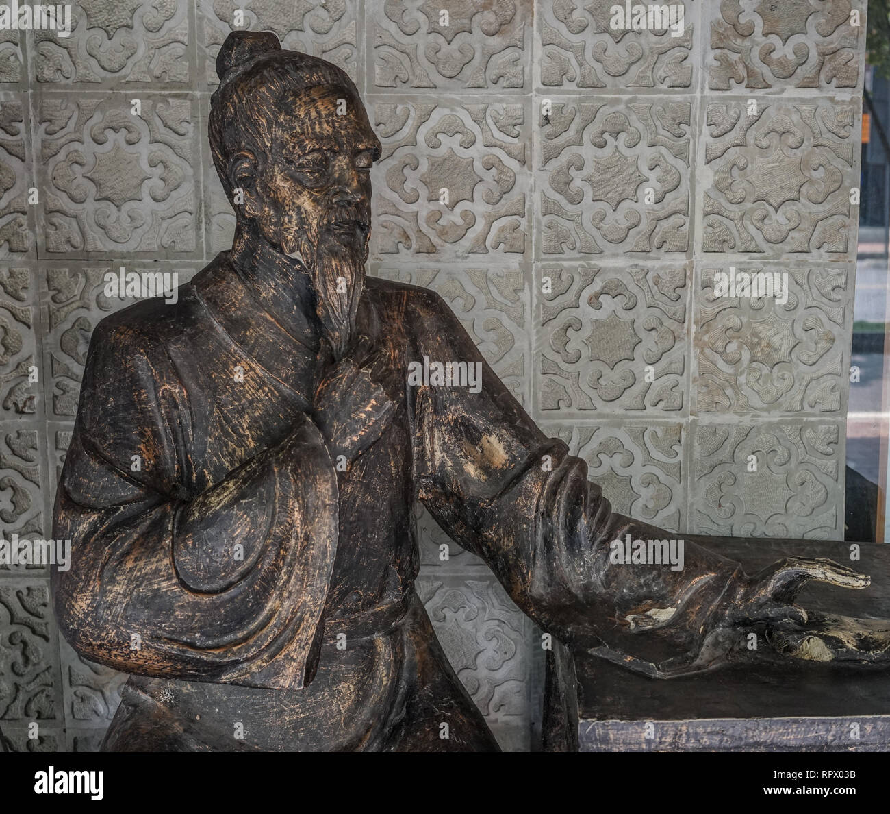 Chengdu, China - Aug 20, 2016. Chinese old man statue at old town in ...