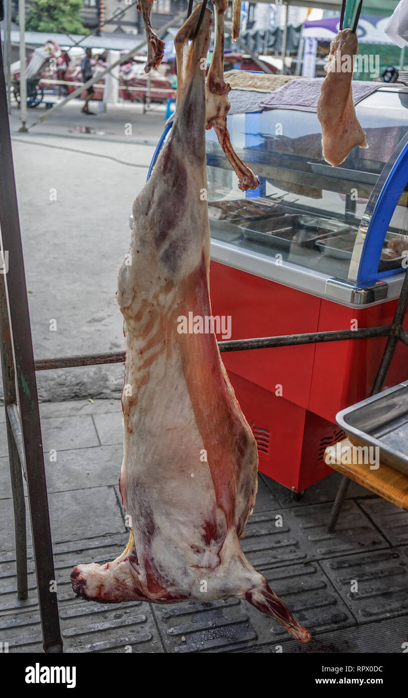 Meat hanging on hooks hi-res stock photography and images - Alamy