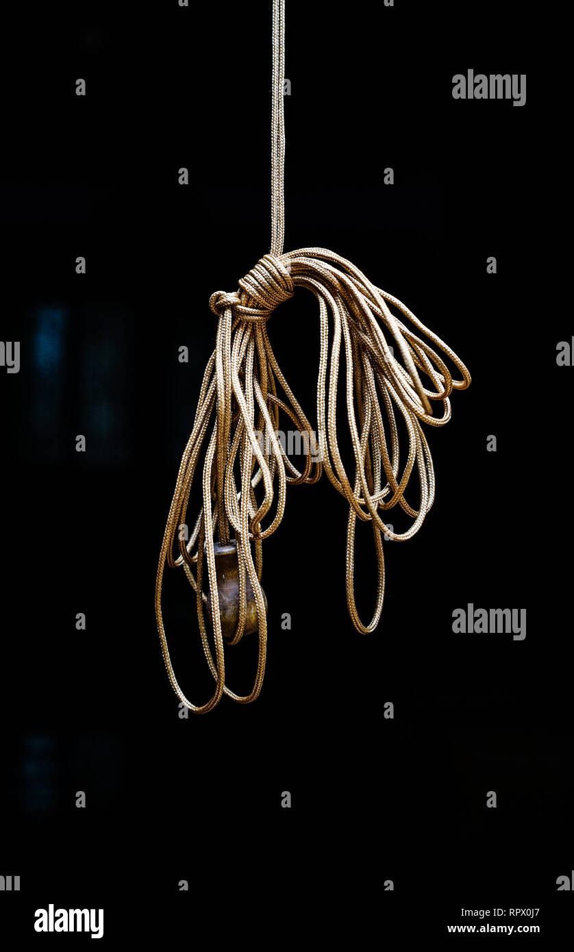 Hanging rope knot on black background. Home related objects Stock Photo ...