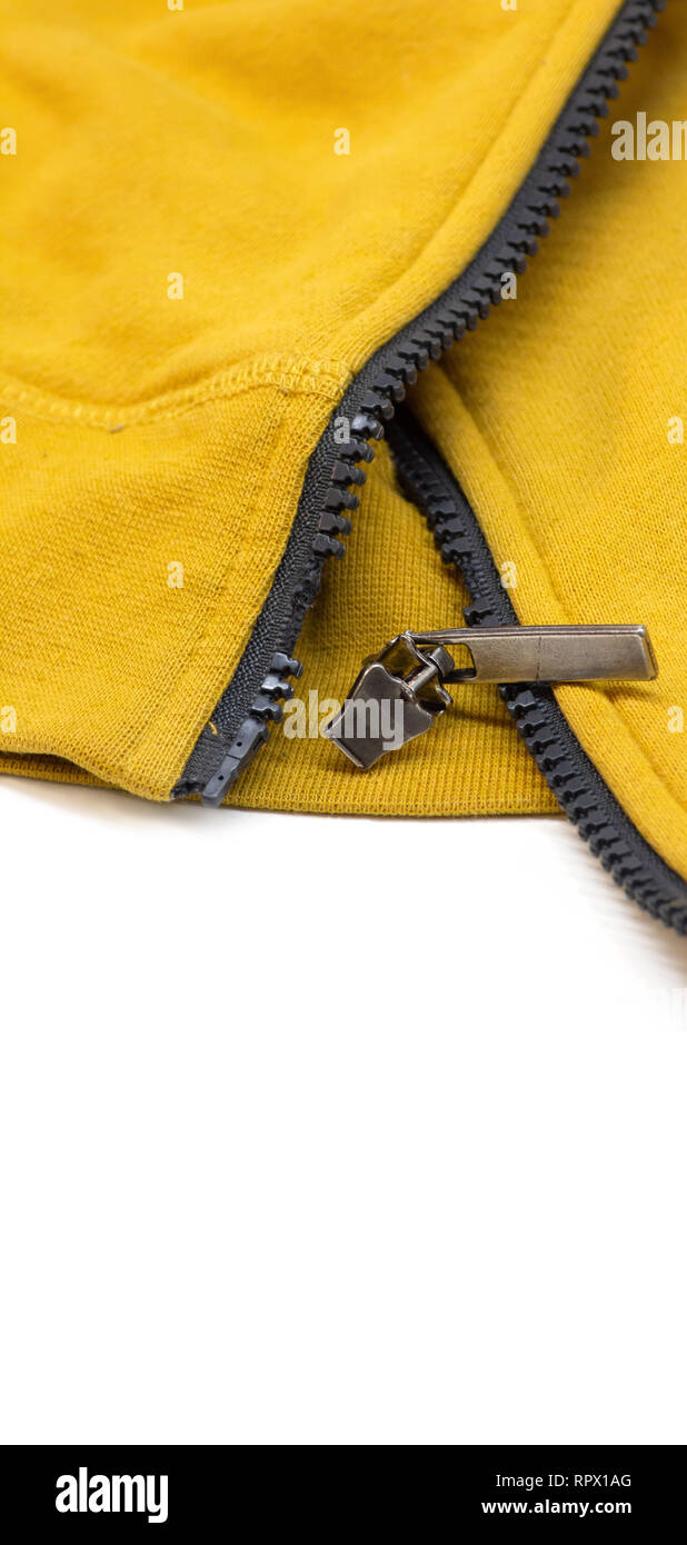 Broken zipper on yellow, color of mustard shirt jacket. Detail close-up ...