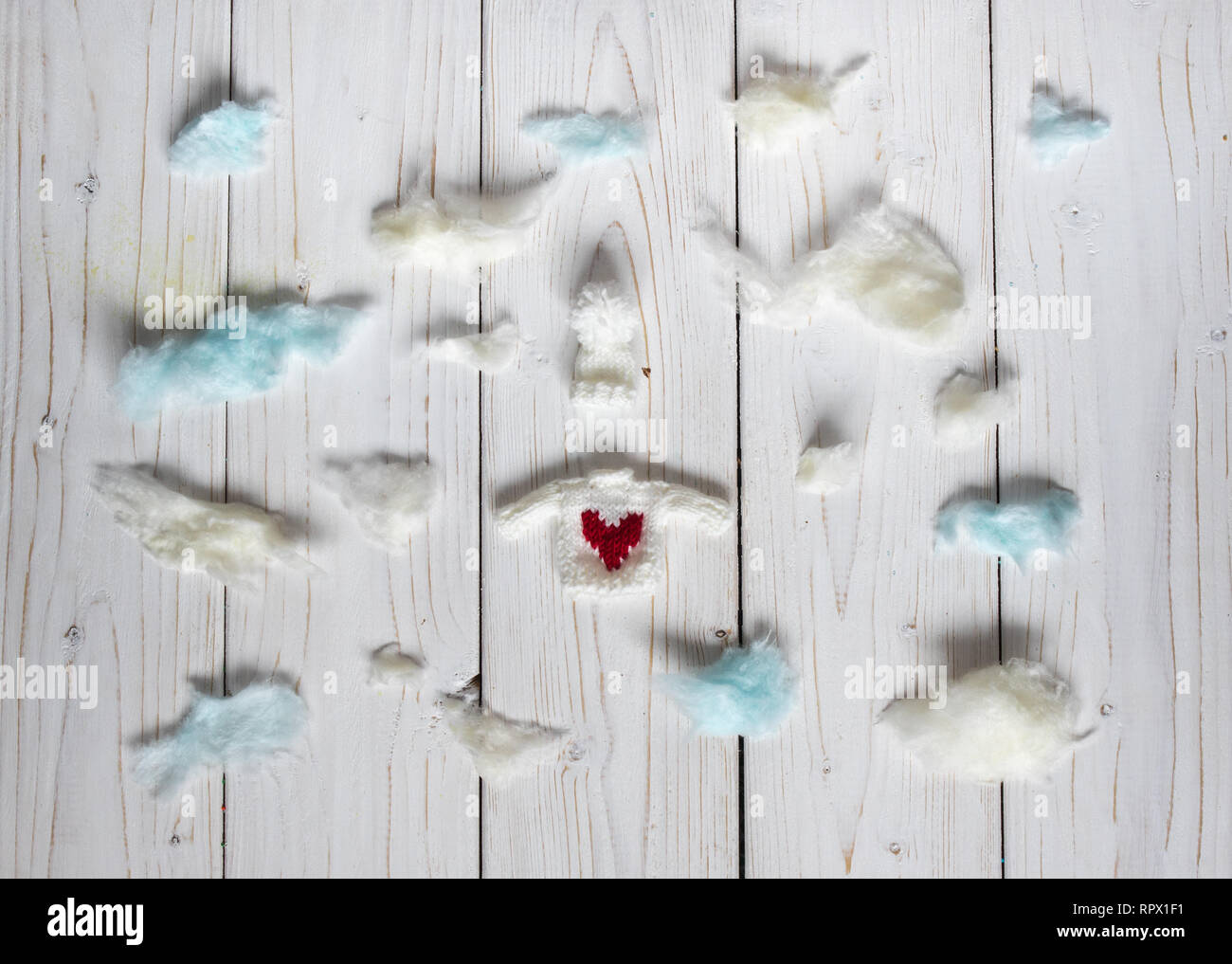 Winter clothes among the clouds, on the white background Stock Photo ...