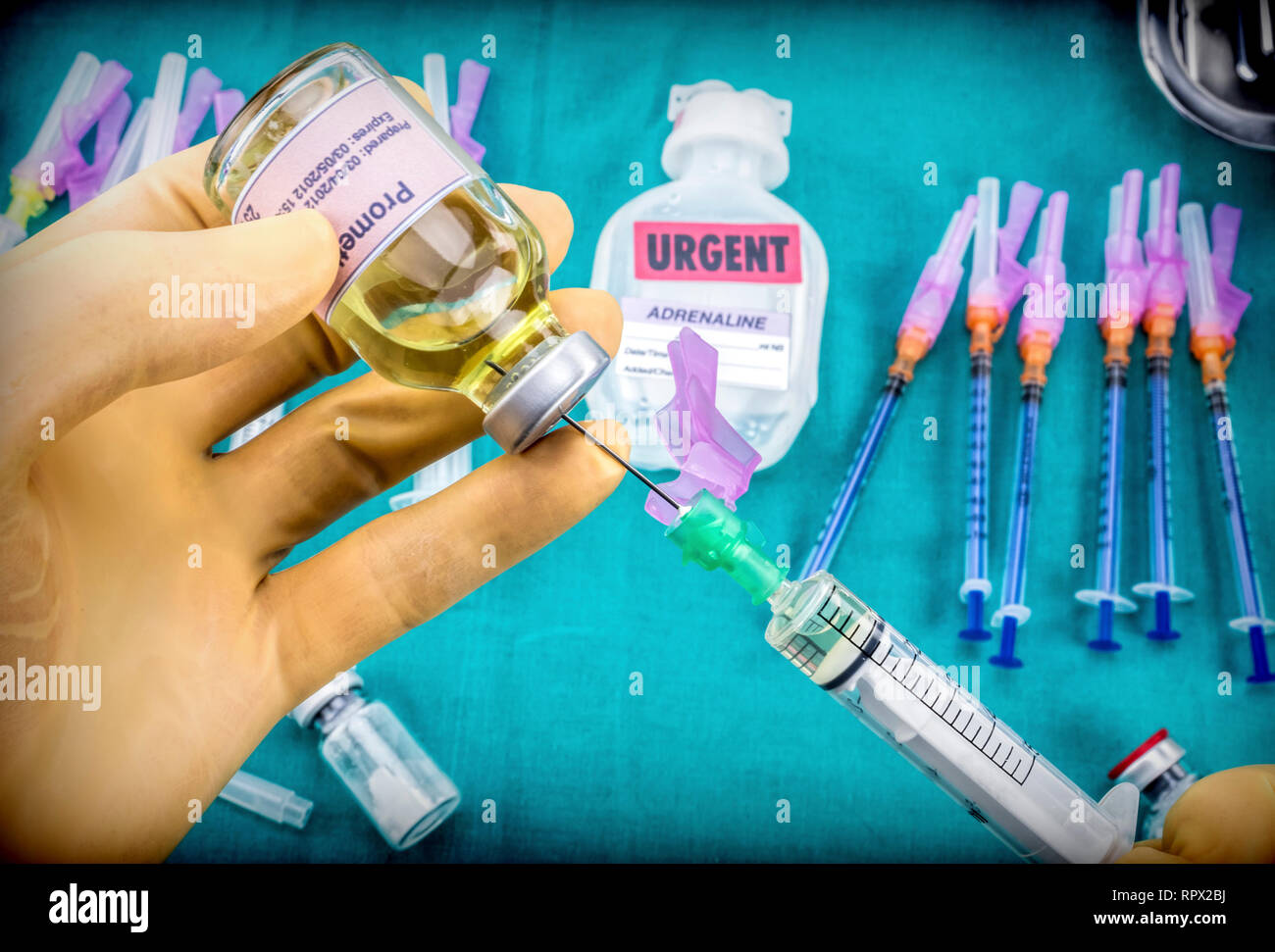 Nurse preparing hospital medication, Extracting with syringe parenteral ...