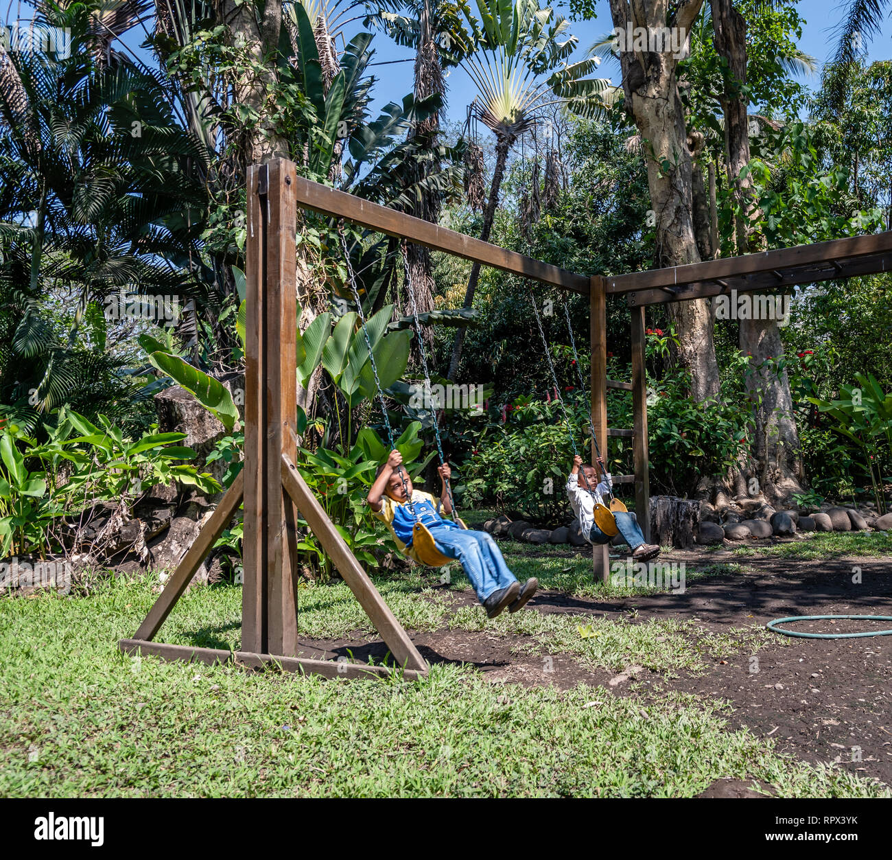latin children playing on playground in Guatemala Stock Photo - Alamy