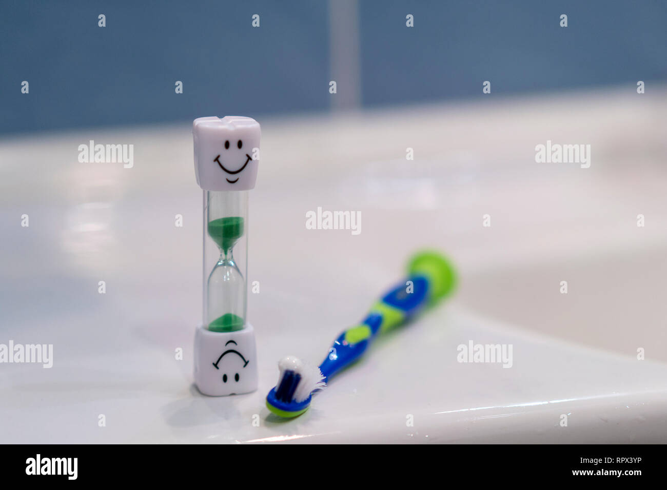 Concept of recommended time to brush your teeth. Soft focus. Two ...