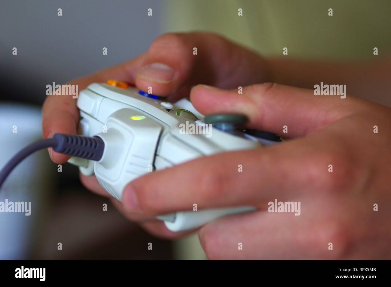 Teenaged boy playing video games hi-res stock photography and images ...
