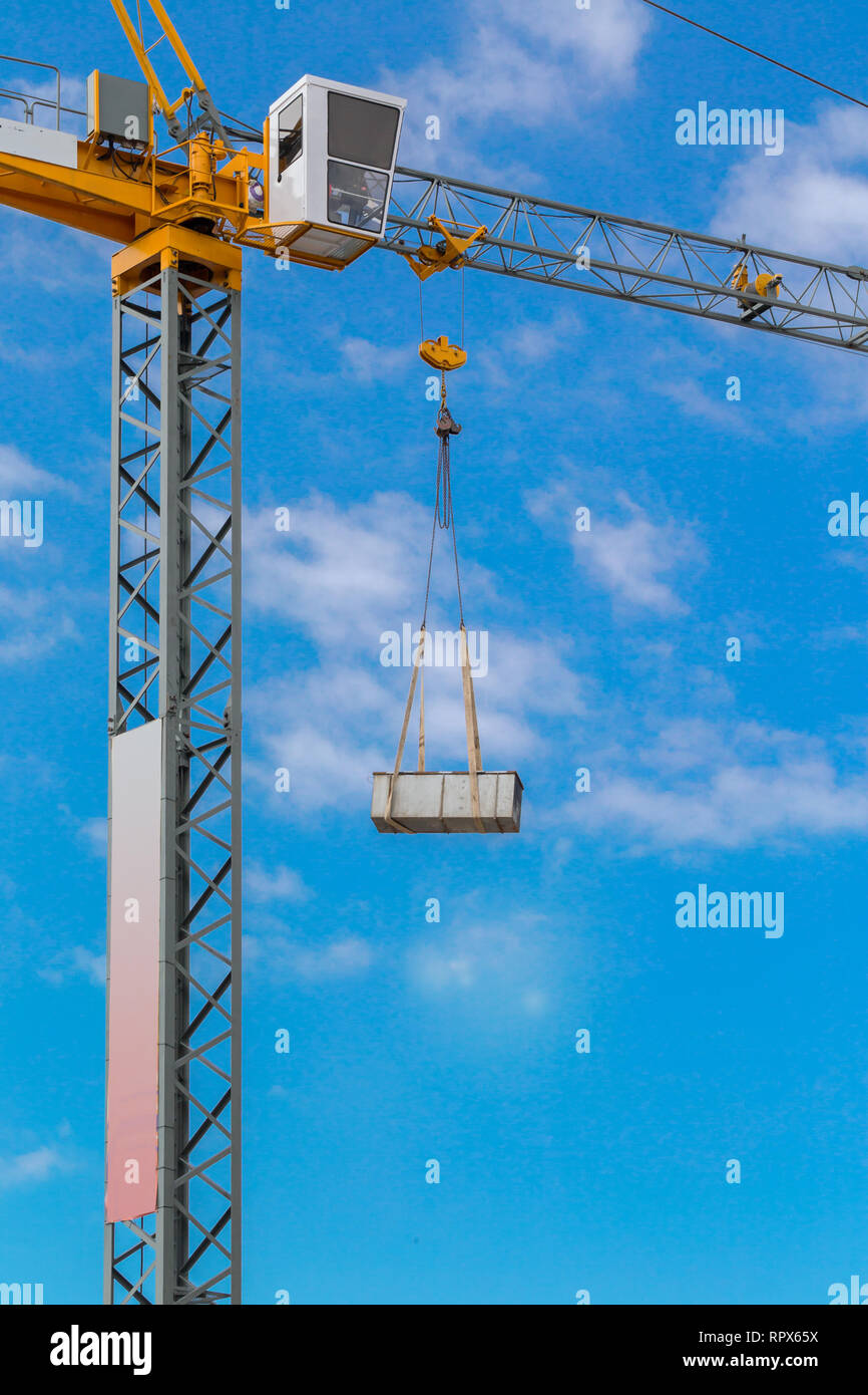 Construction tower crane against the blue sky Stock Photo - Alamy