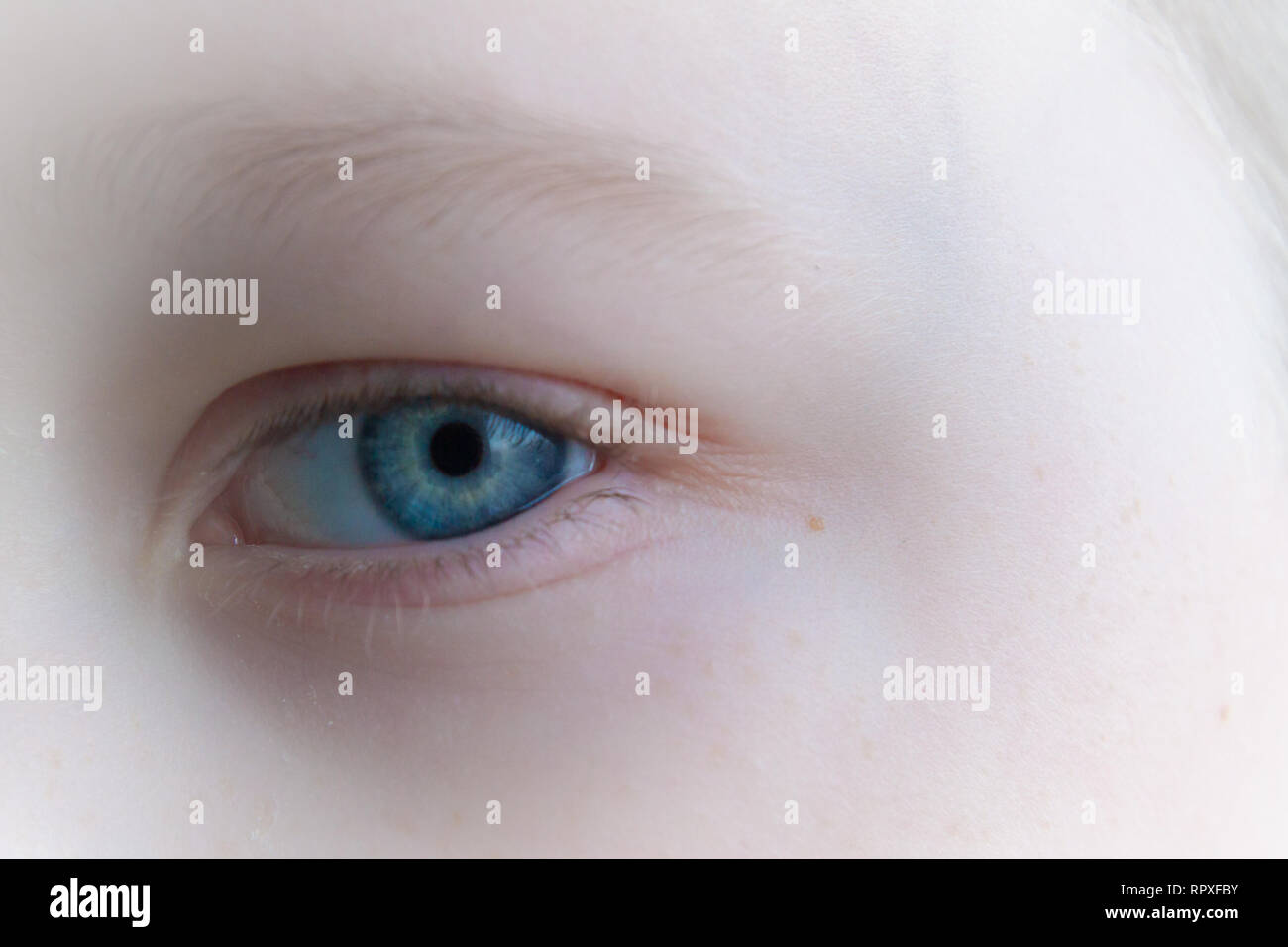 Baby blue beautiful, brooding eyes of a boy Stock Photo - Alamy