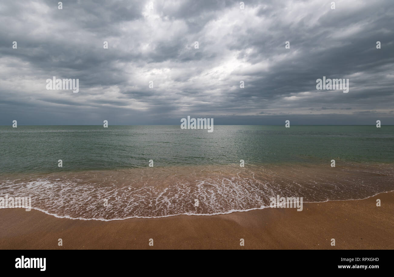 Sea coast in cloudy weather Stock Photo - Alamy