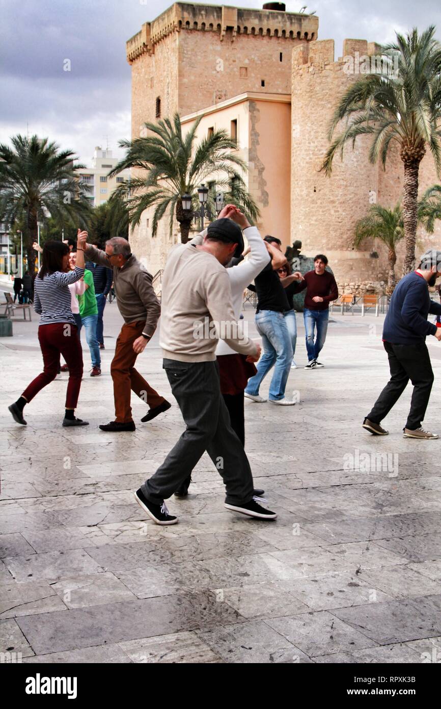 Elche, Alicante, Spain- February 19, 2019: People enjoying and dancing ...