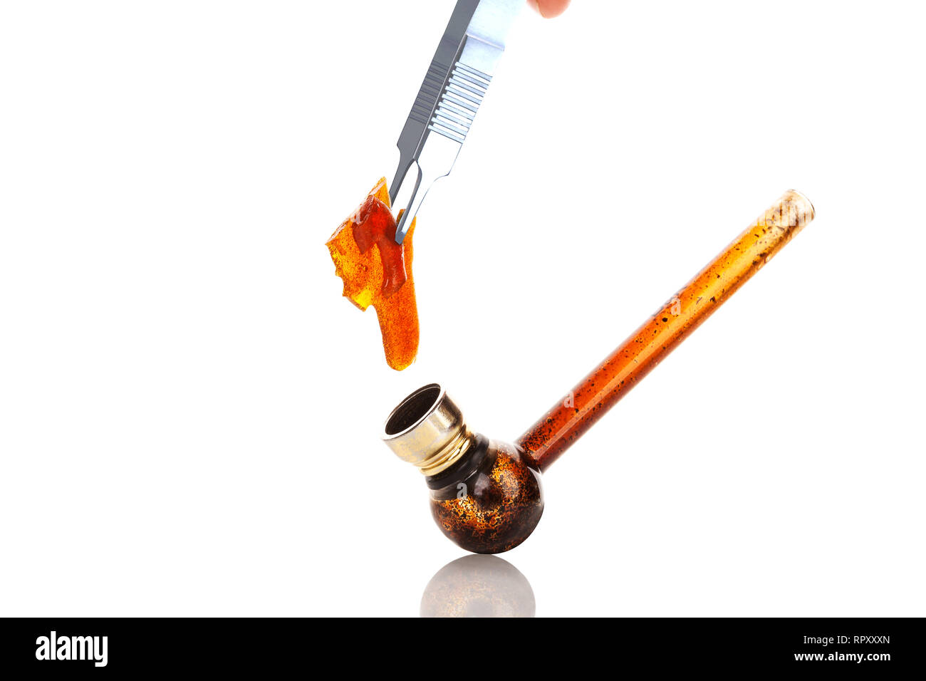 Marijuana concentrate shatter and glass pipe with residue isolated on ...