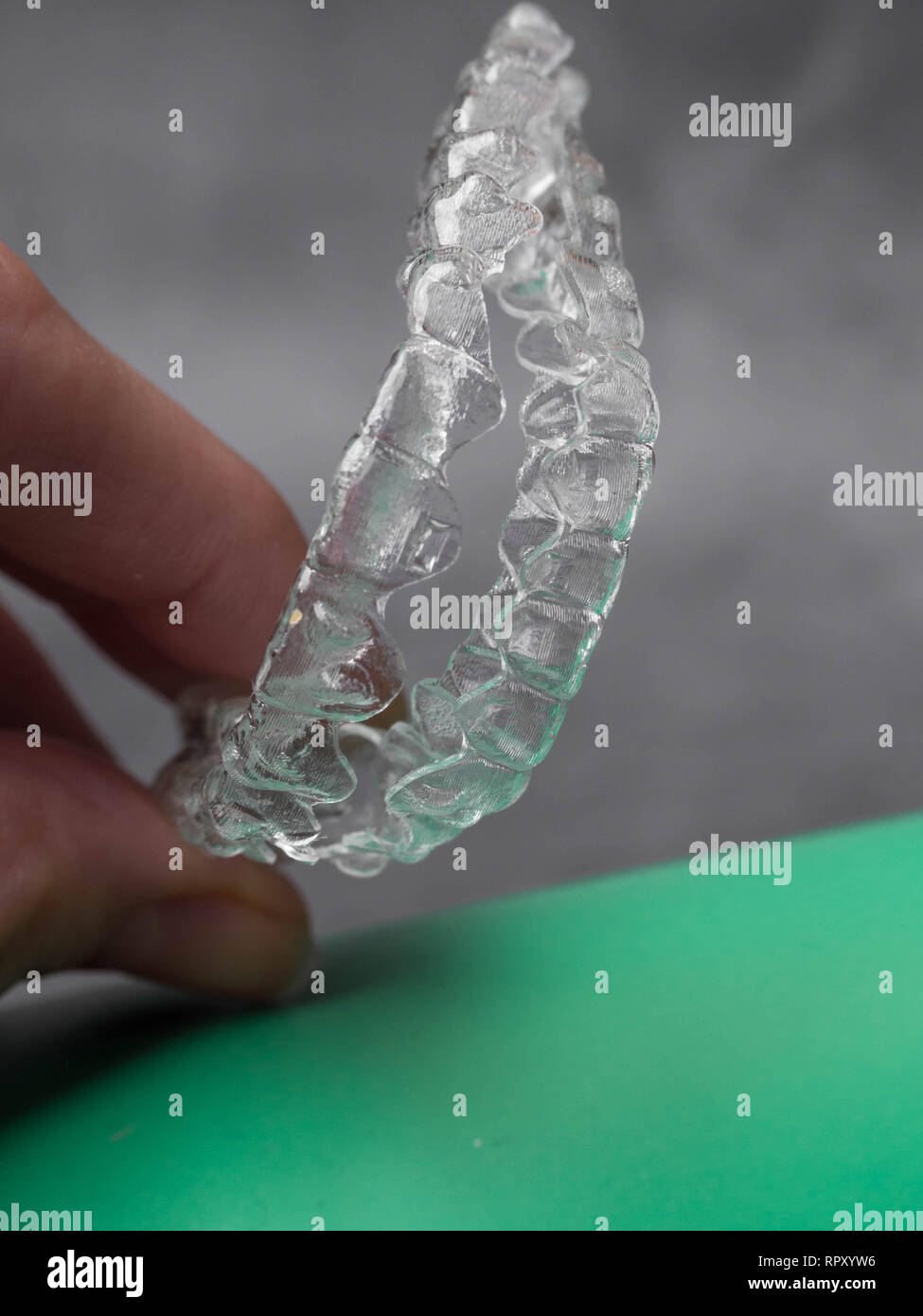 Hand hold invisible aligners plastic braces dentistry retainers to ...