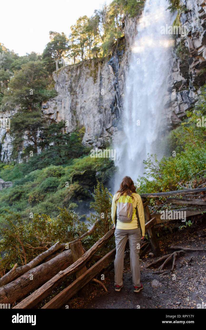 rear view of woman standing in front of waterfall Stock Photo - Alamy