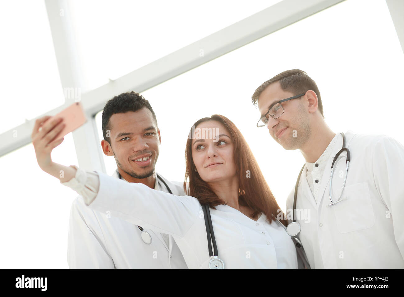 close up.group of medical doctors taking selfies Stock Photo - Alamy