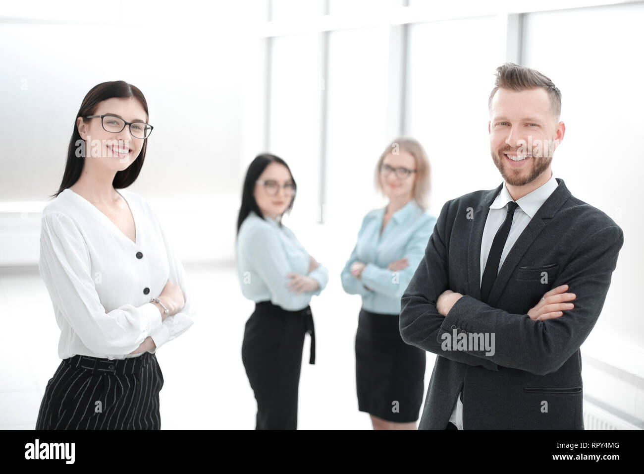 group of successful employees standing in the office Stock Photo - Alamy