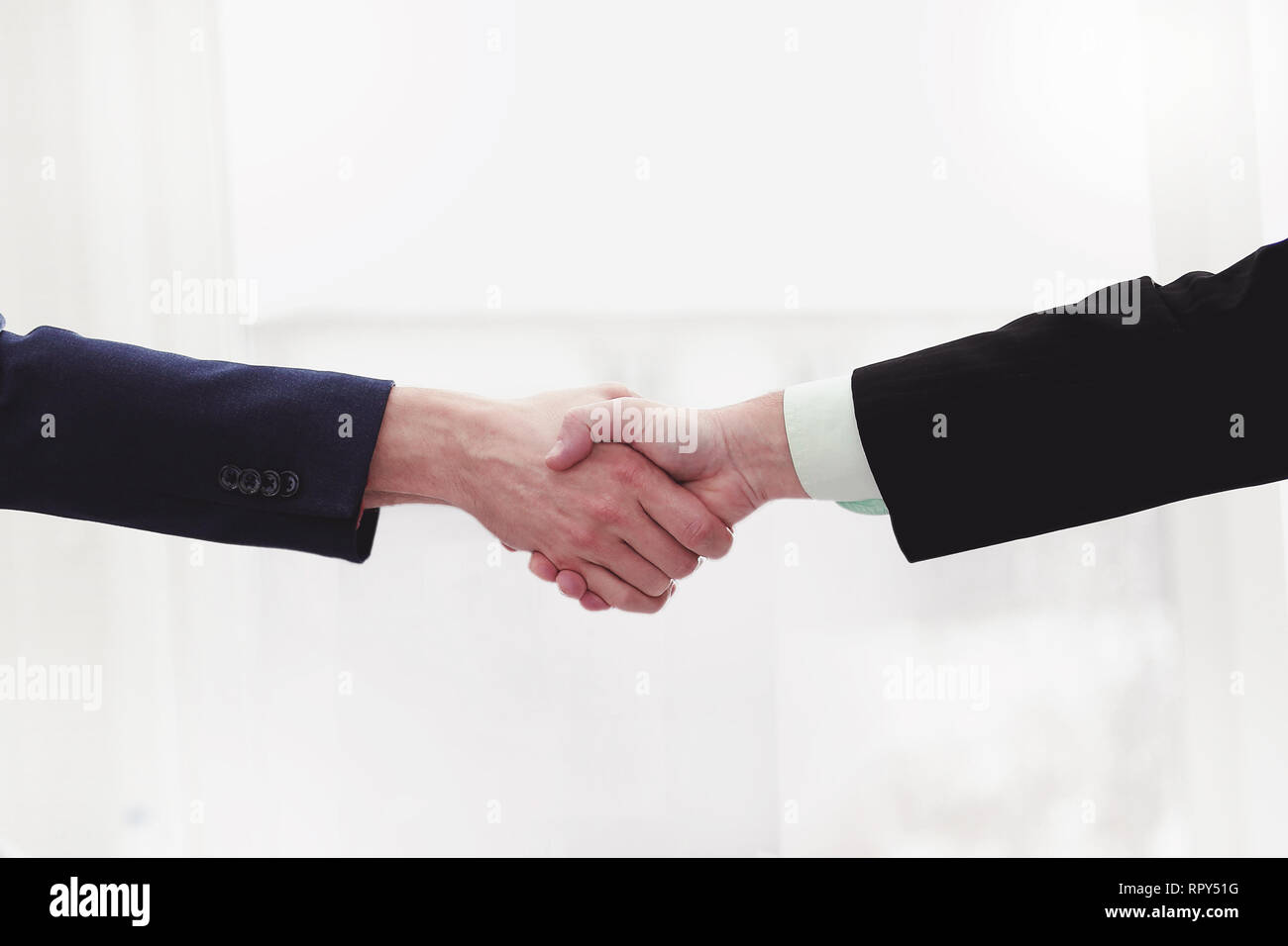 close up.handshake of financial partners on desktop background Stock ...