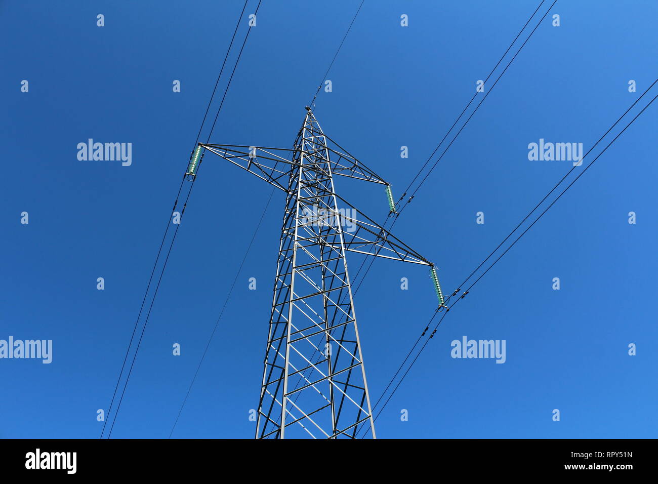 Mighty tall power line utility pole made of strong metal pipes with ...