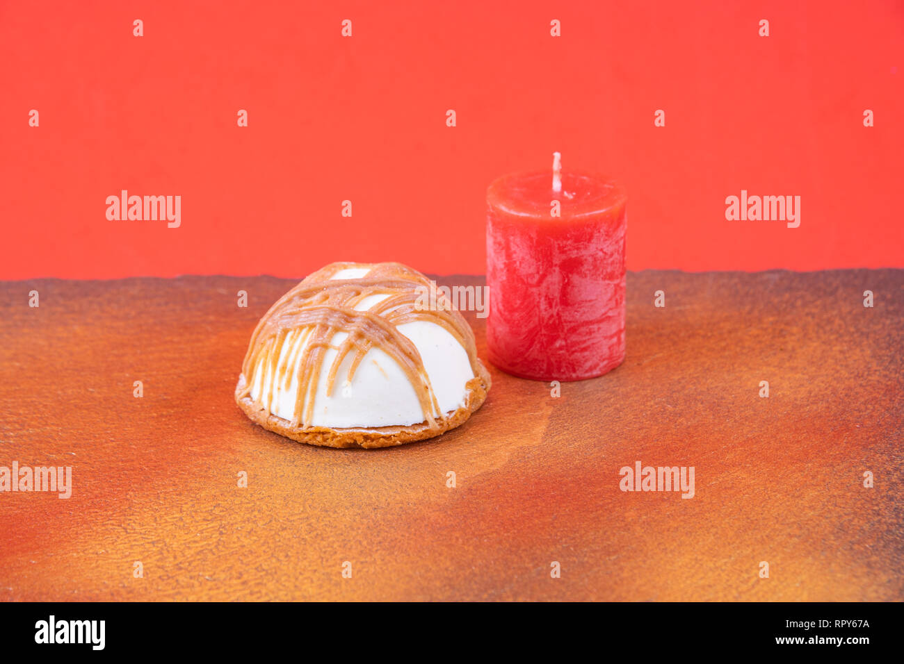 light and sumptuous pastry on a decorated support and with a colored ...