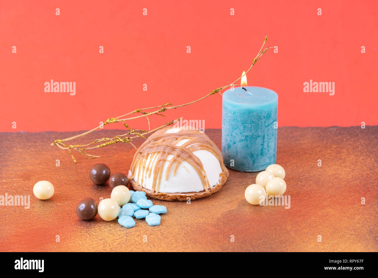 light and sumptuous pastry on a decorated support and with a colored ...