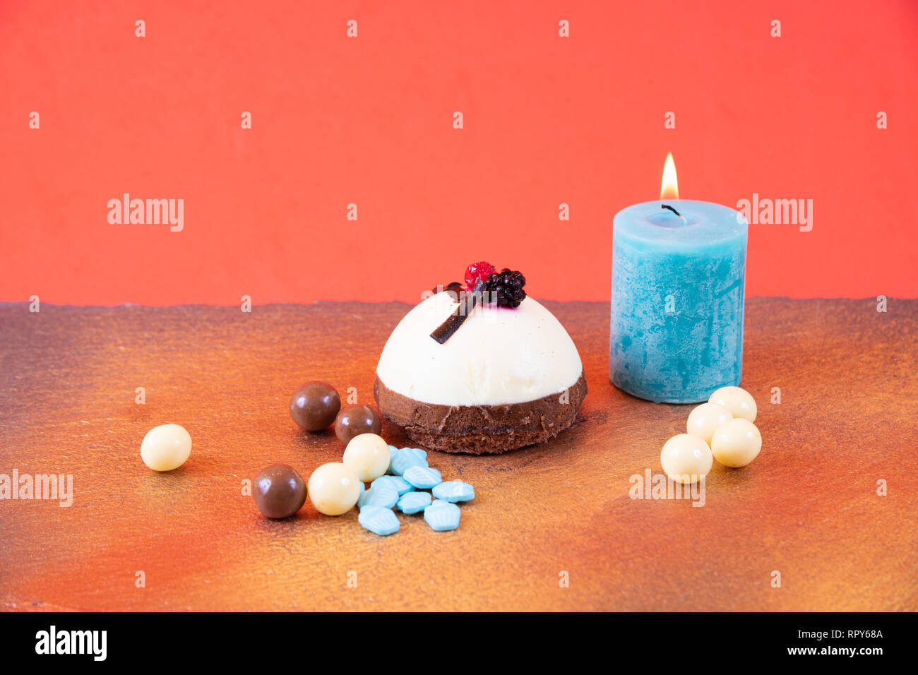 light and sumptuous pastry on a decorated support and with a colored ...