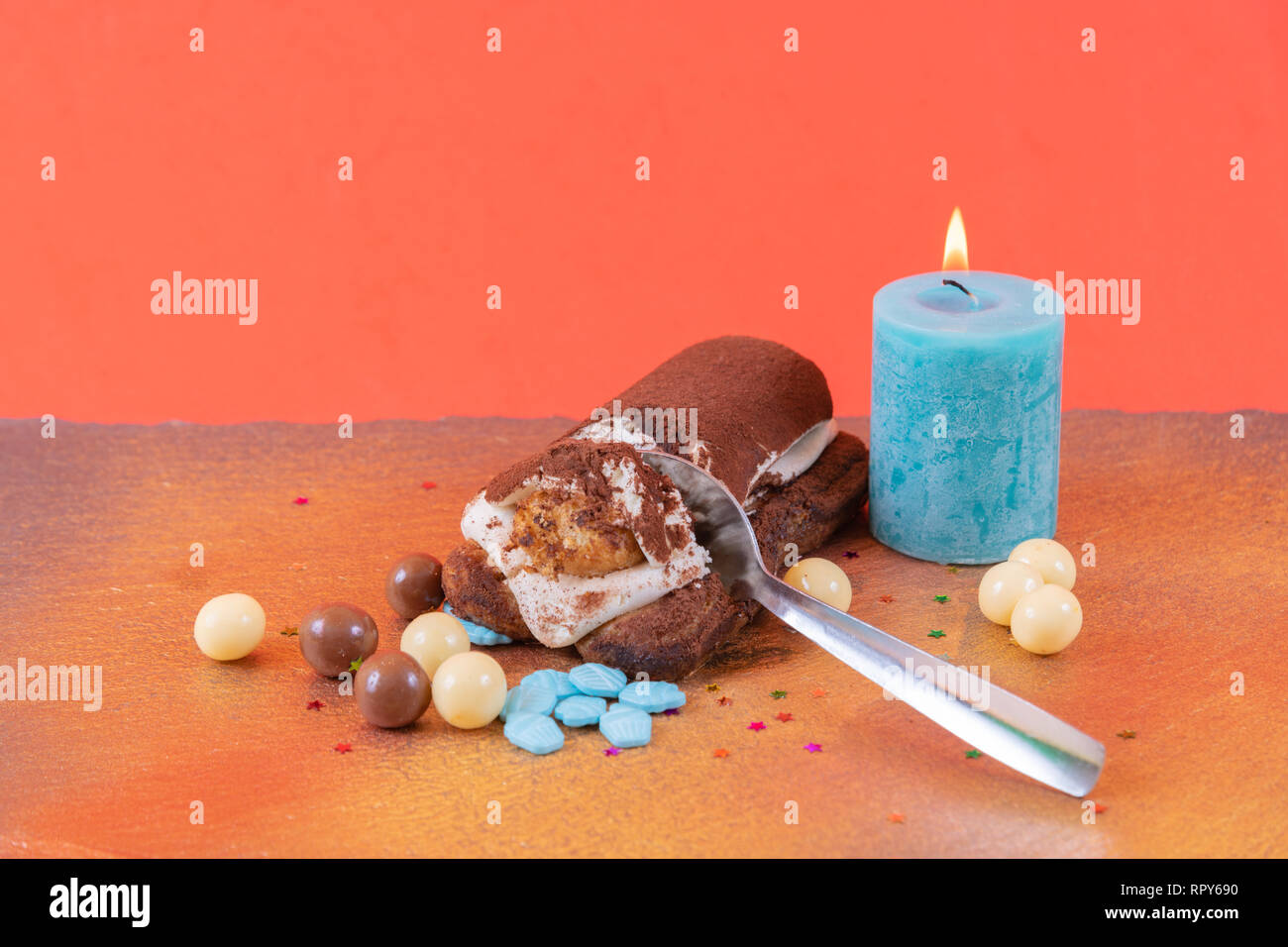 light and sumptuous pastry on a decorated support and with a colored ...