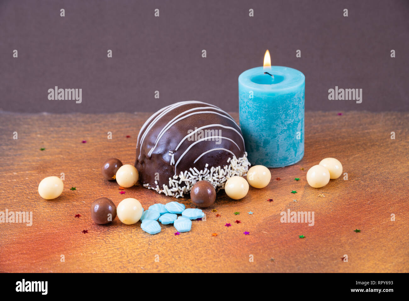 light and sumptuous pastry on a decorated support and with a colored ...