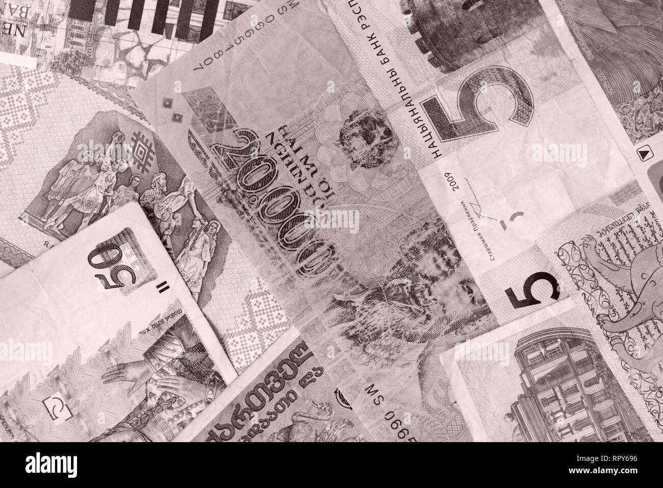 Different countries money background close up. Brown color toned Stock ...