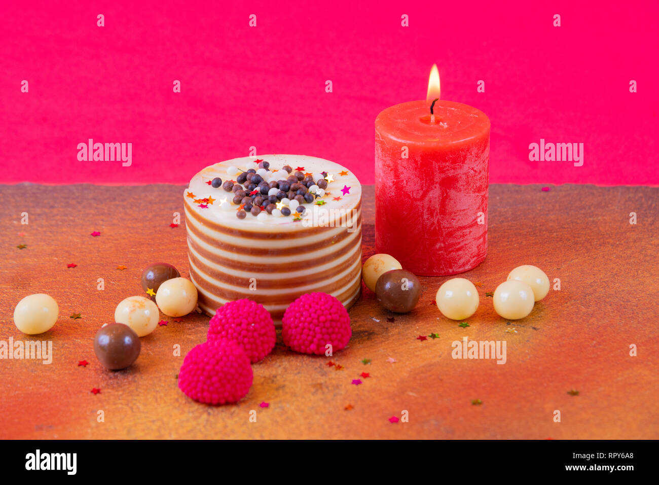 light and sumptuous pastry on a decorated support and with a colored ...